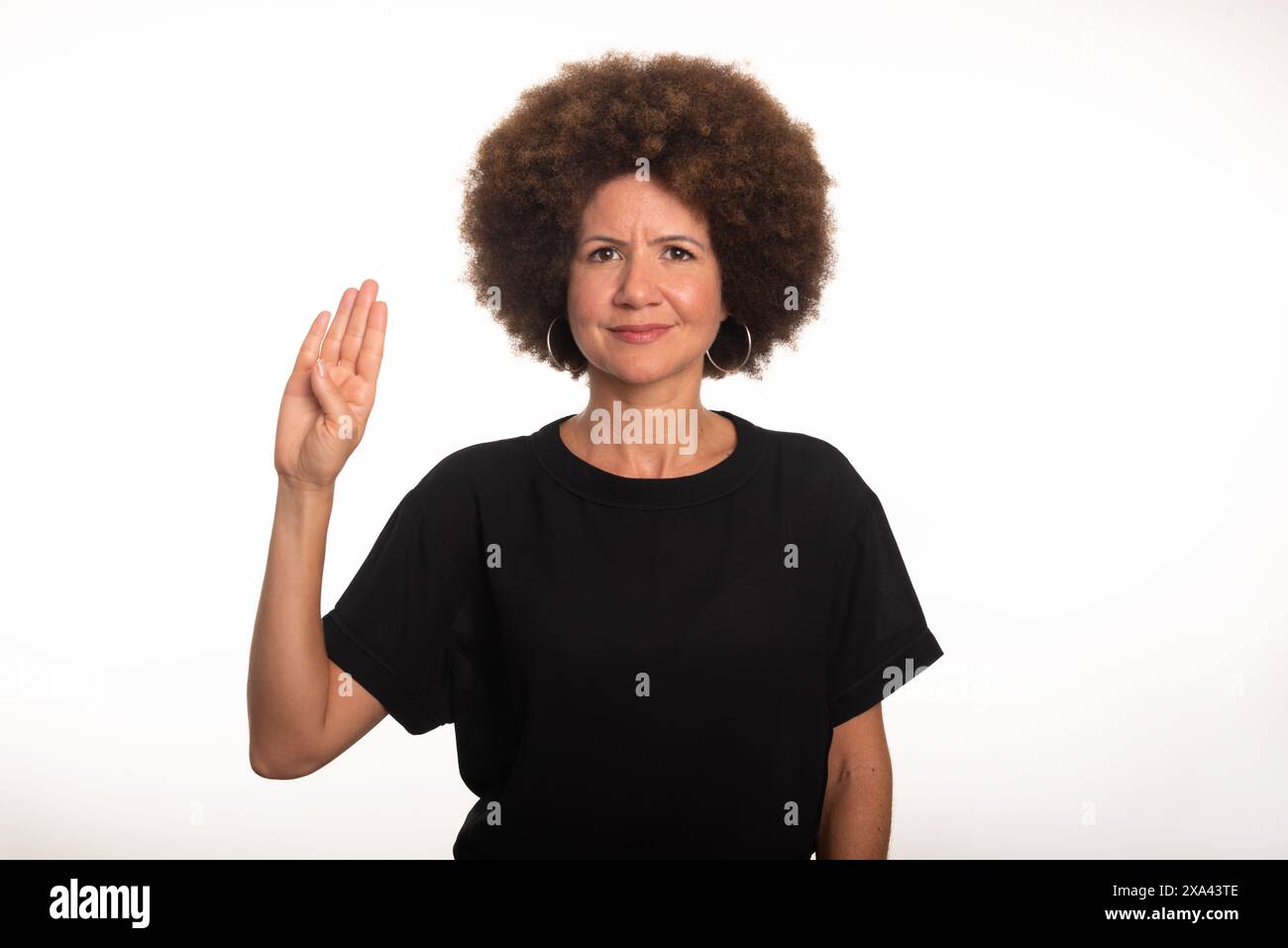 Interpreter of the Brazilian sign language, Libras, making the letter B ...