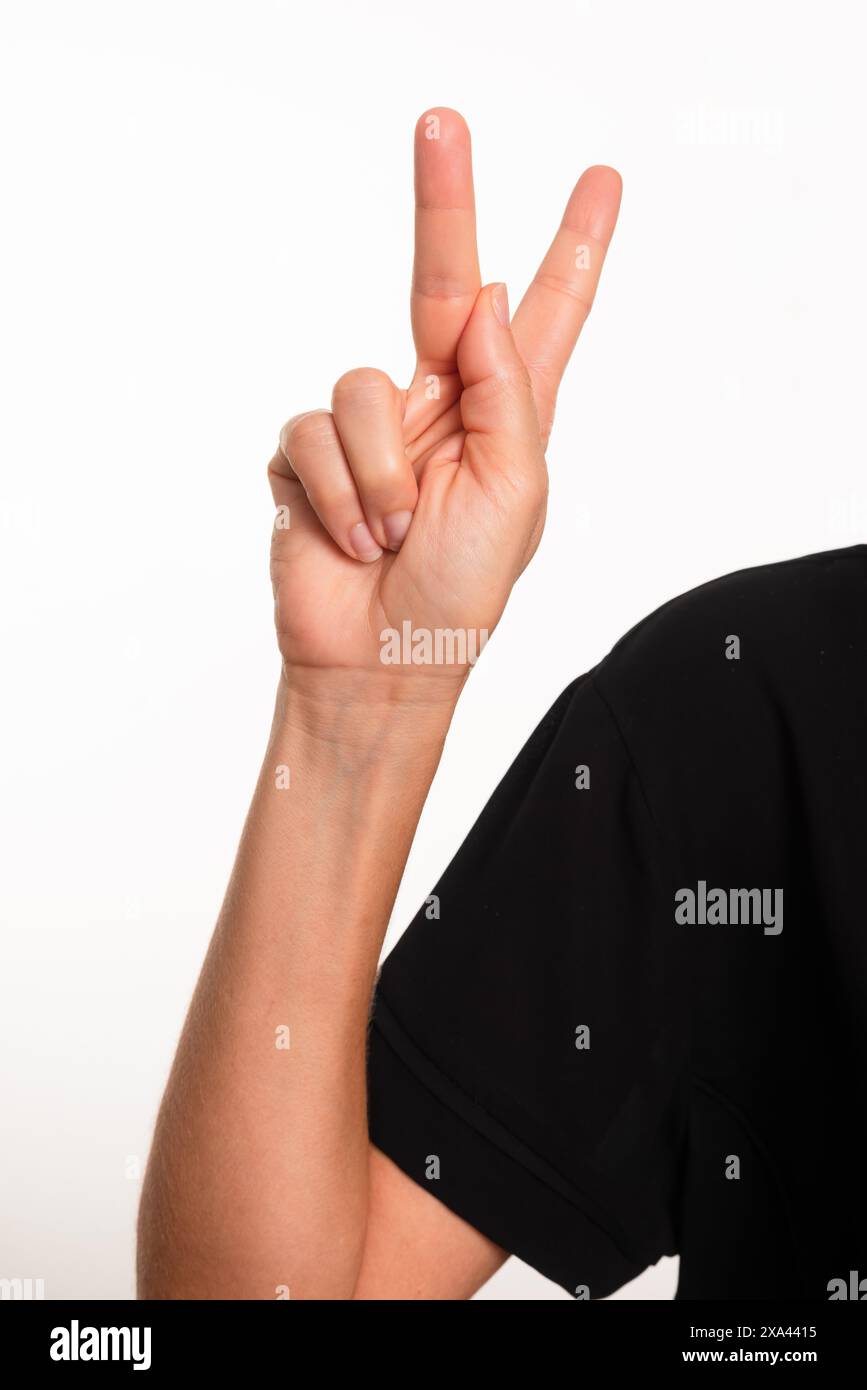 Close-up of a hand making the letter H in Brazilian sign language for ...