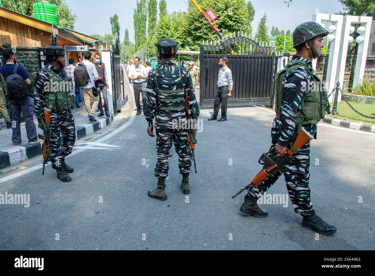 Indian paramilitary troopers stand on guard outside the venue where ...