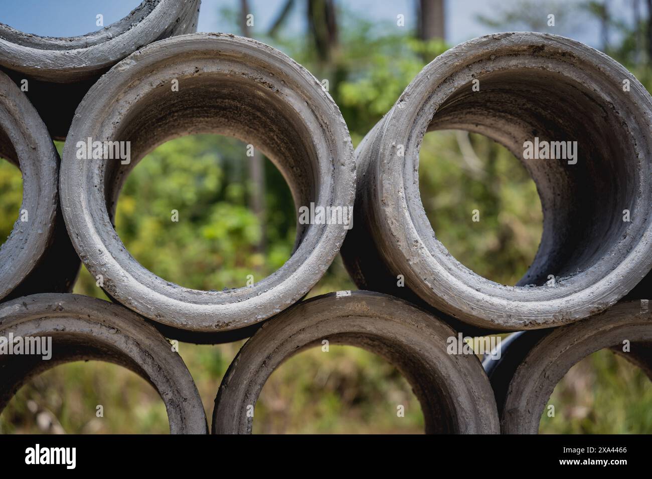 A stack of concrete ring pipes piled and creating a symmetrical ...