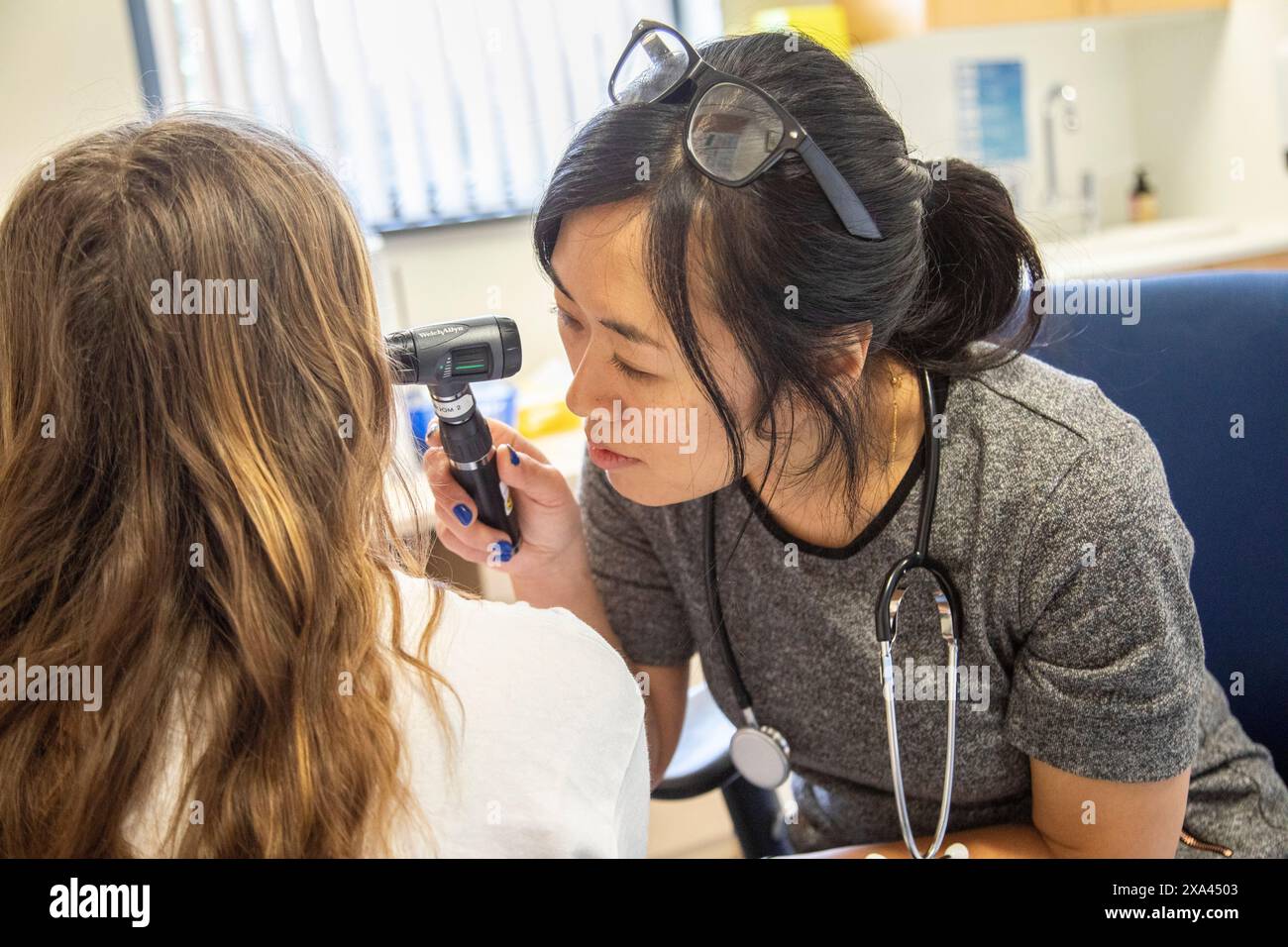 Doctor ear examination hi-res stock photography and images - Alamy