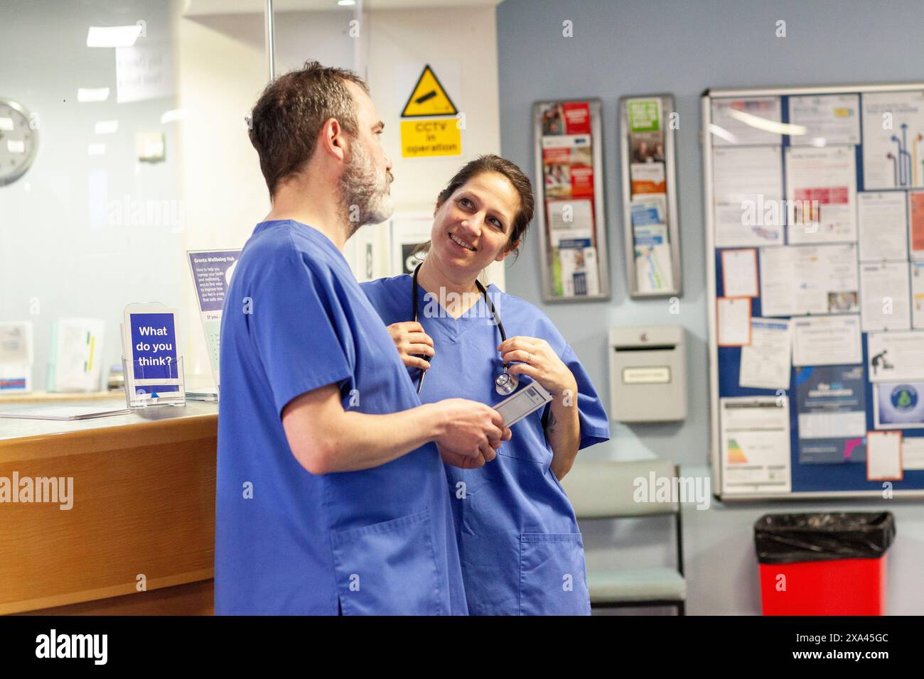 Two healthcare professionals interacting in a hospital setting Stock ...