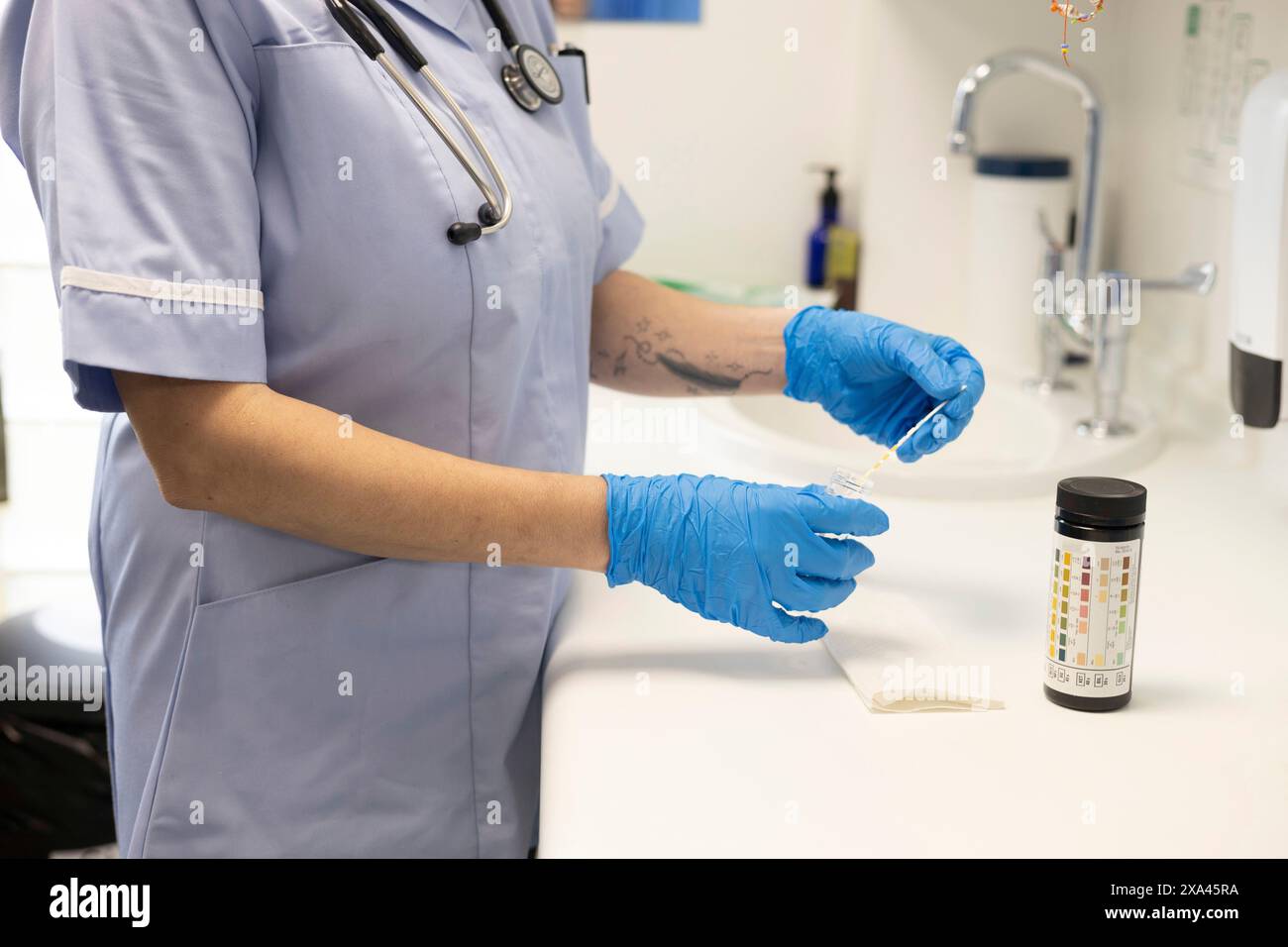 Nurse in medical gloves testing hi-res stock photography and images - Alamy
