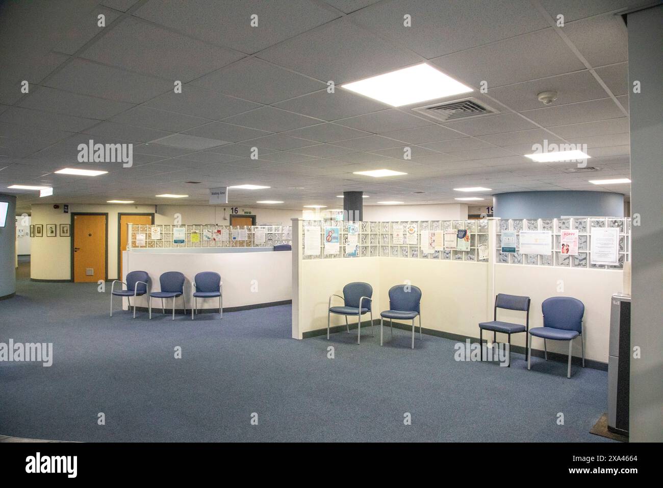 Empty Spacious waiting area with chairs and bulletin boards in a ...