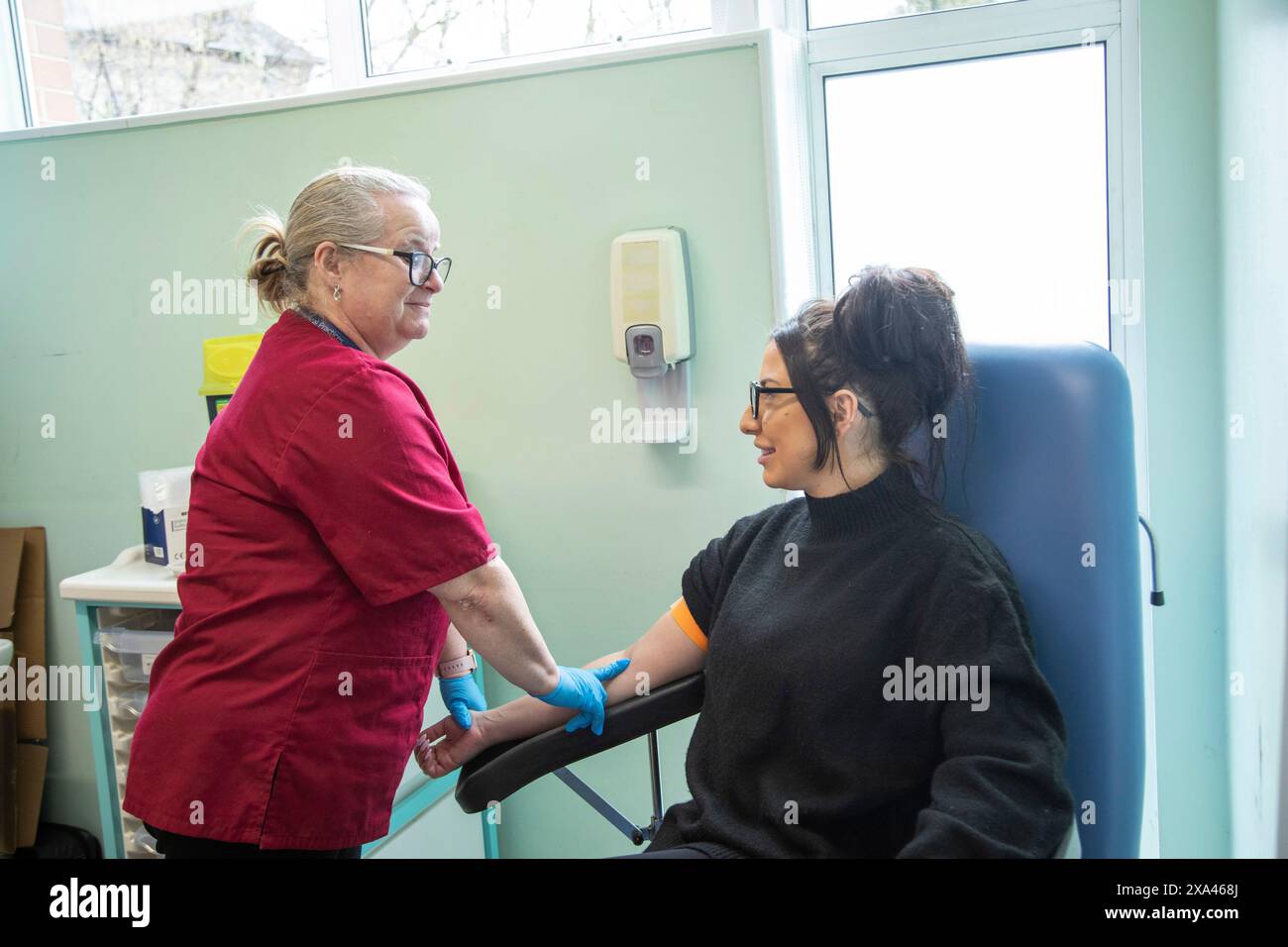 Nurse and a sliming patient Stock Photo - Alamy