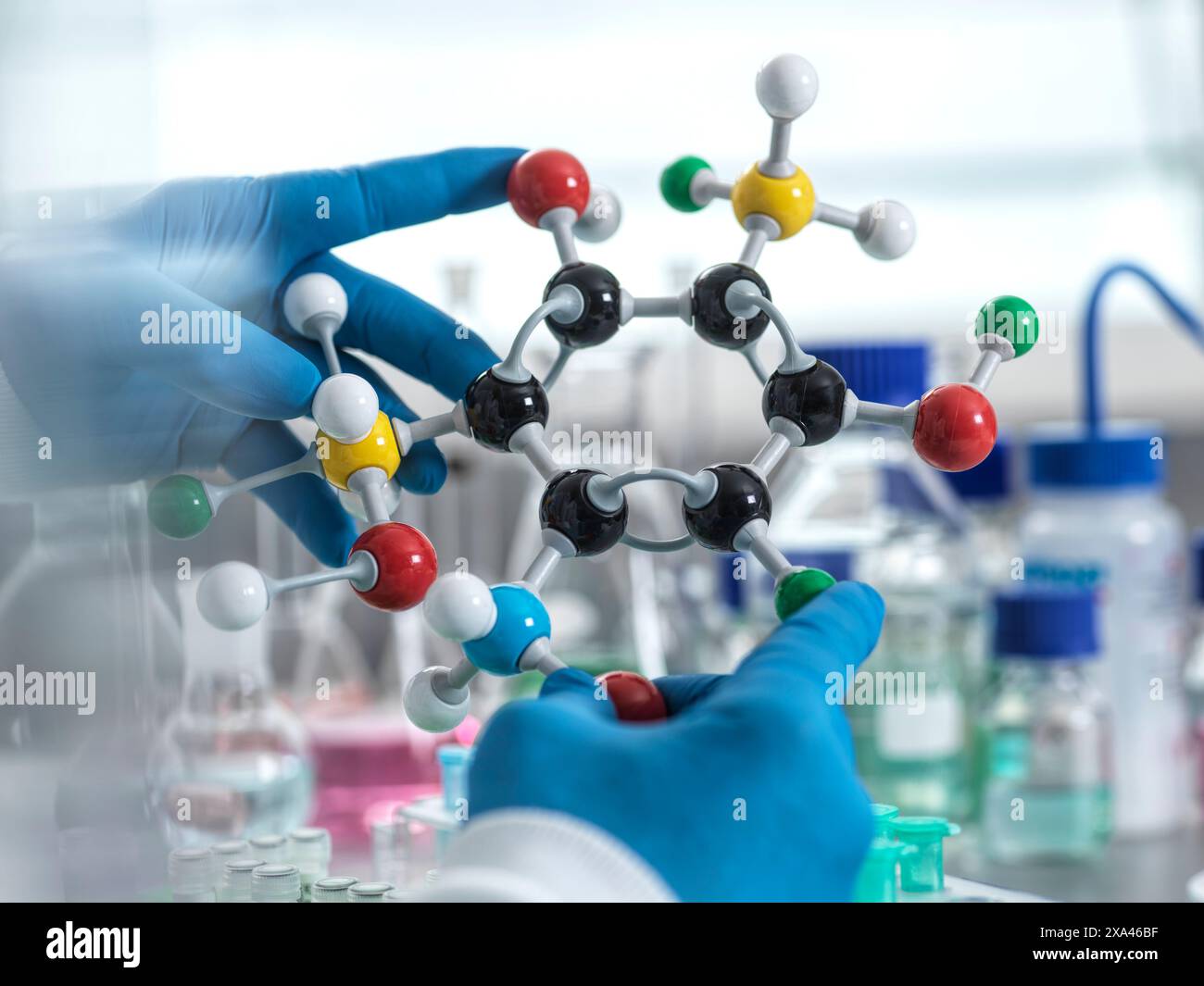 Scientist holding a molecular model in a laboratory Stock Photo - Alamy