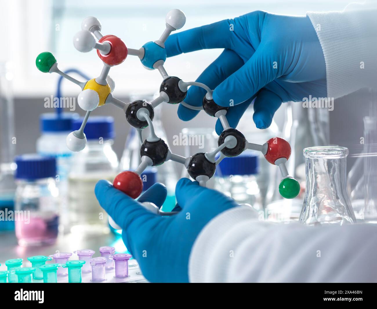 Scientist holding a molecular model in a laboratory Stock Photo - Alamy