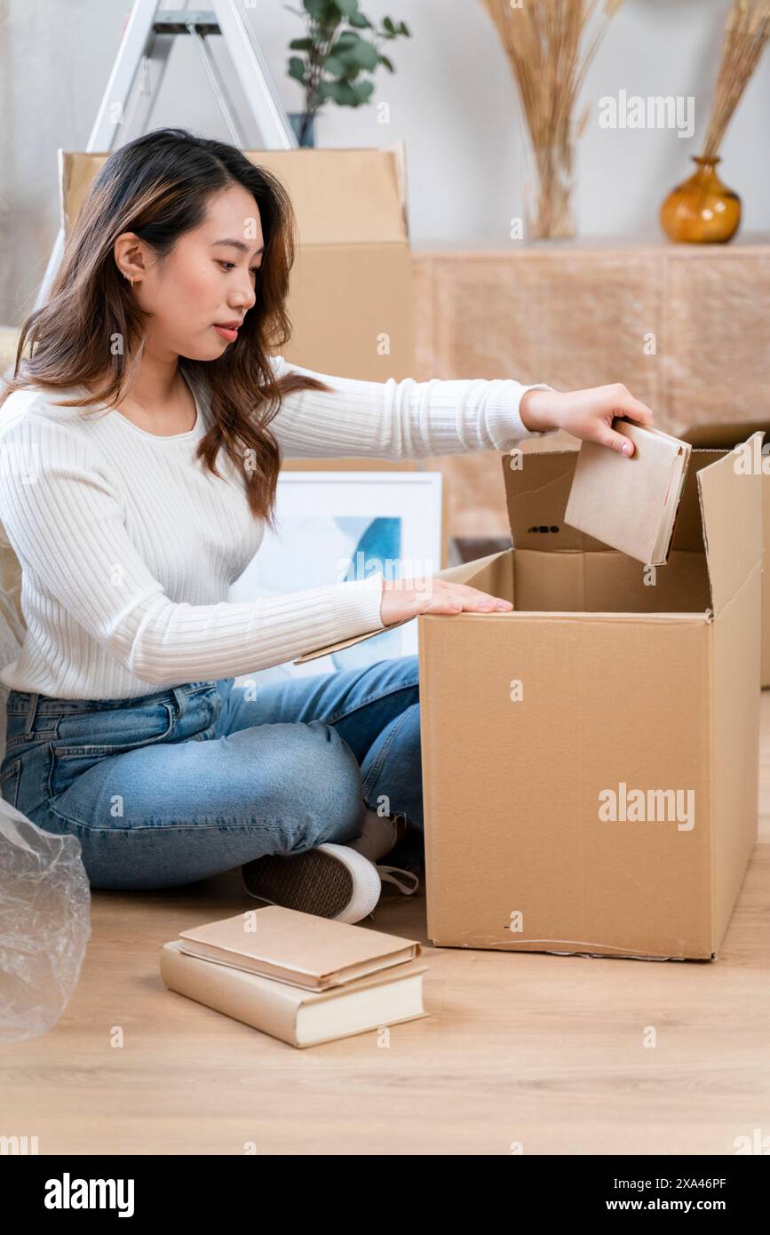 Woman packing cardboard box hi-res stock photography and images - Alamy