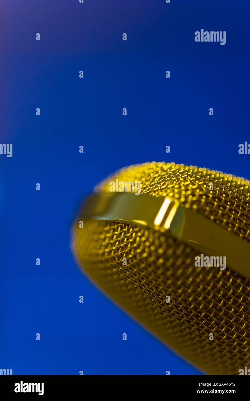 Extreme close up of a gold microphone Stock Photo - Alamy