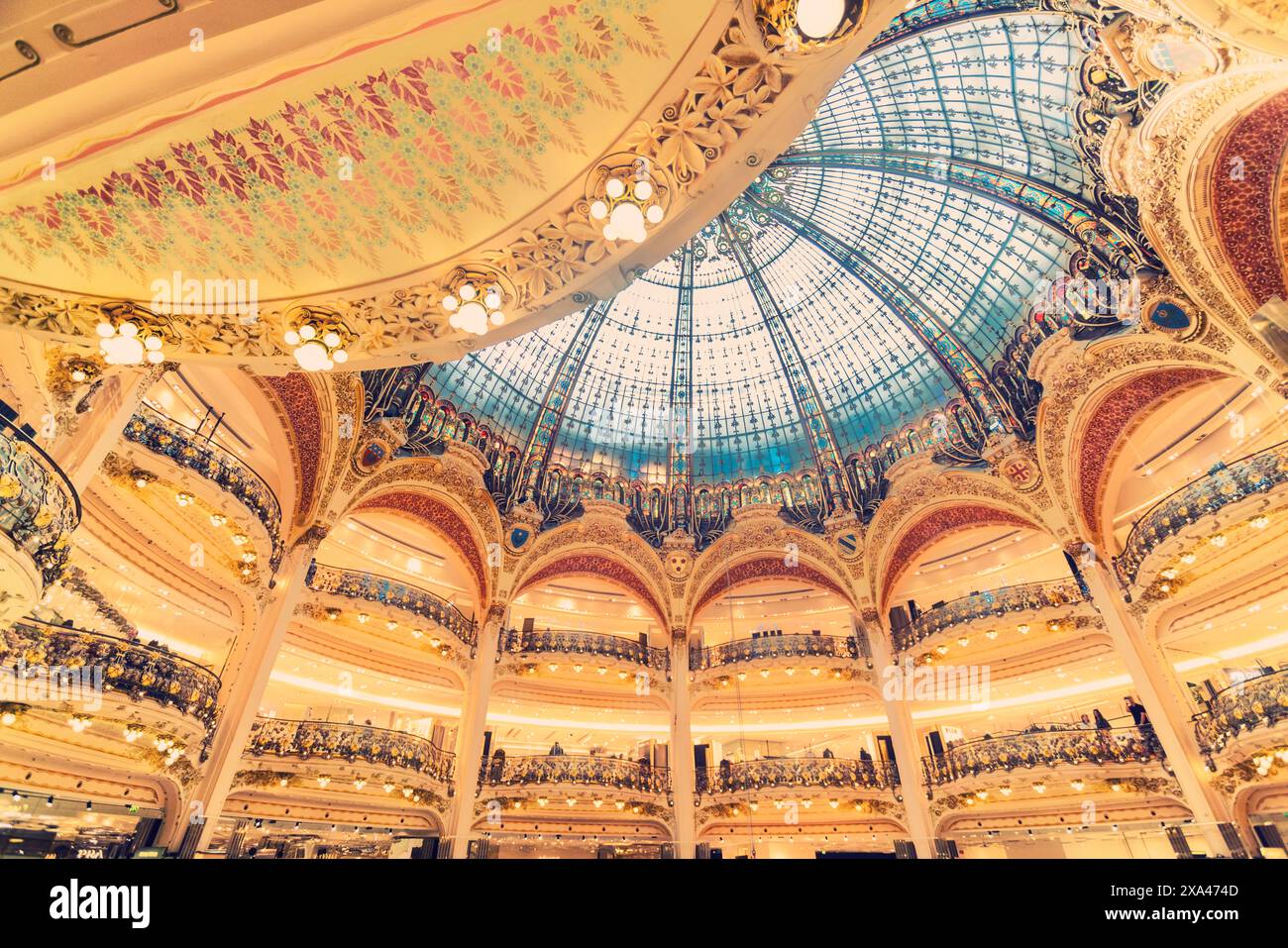 Ornate interior of a grand shopping gallery with a glass dome Stock ...