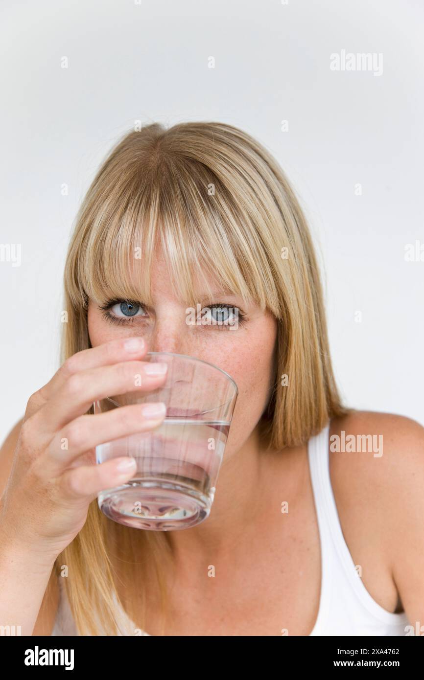 Person eating and drinking water hi-res stock photography and images ...