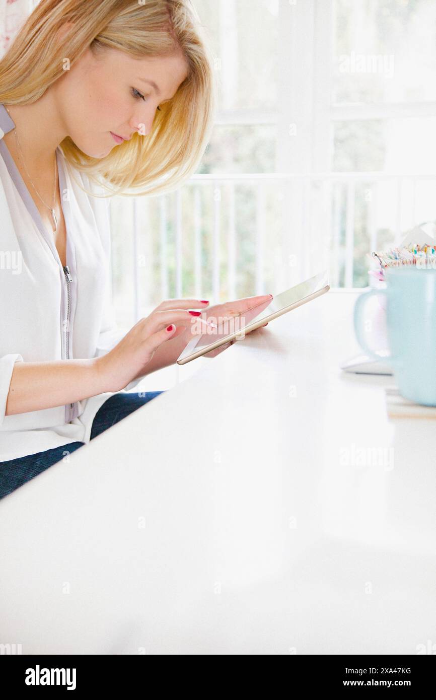 Attractive young woman using technology hi-res stock photography and ...
