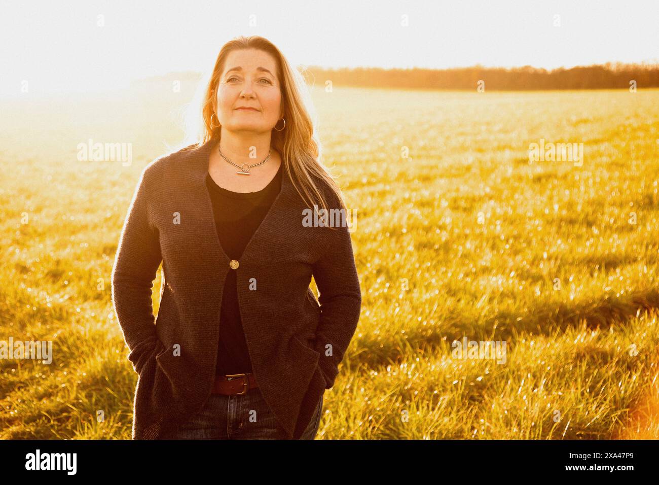 Older woman standing outside hi-res stock photography and images - Alamy