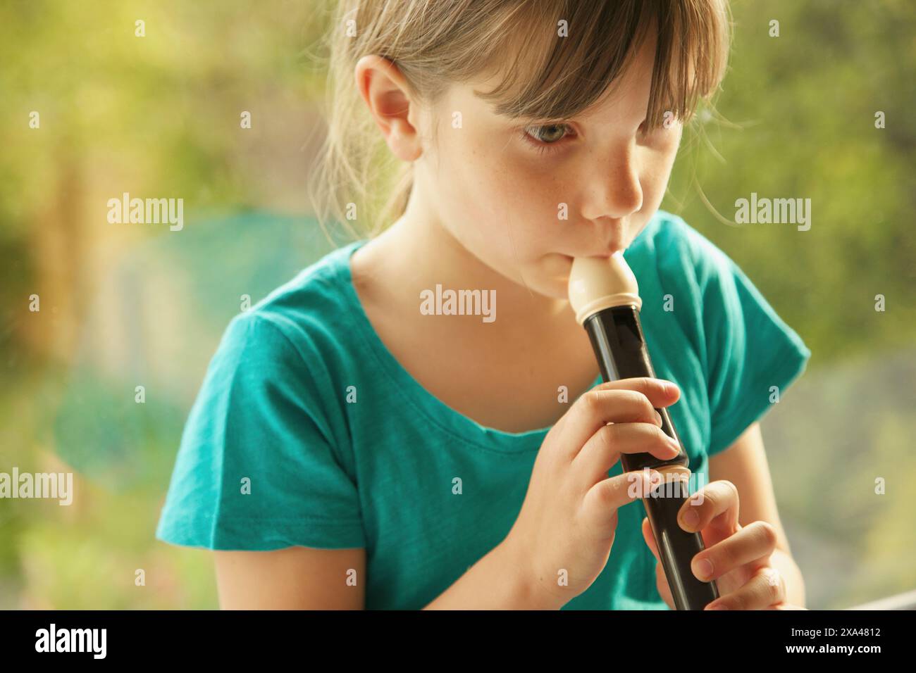 Young Girl Playing Recorder Stock Photo - Alamy