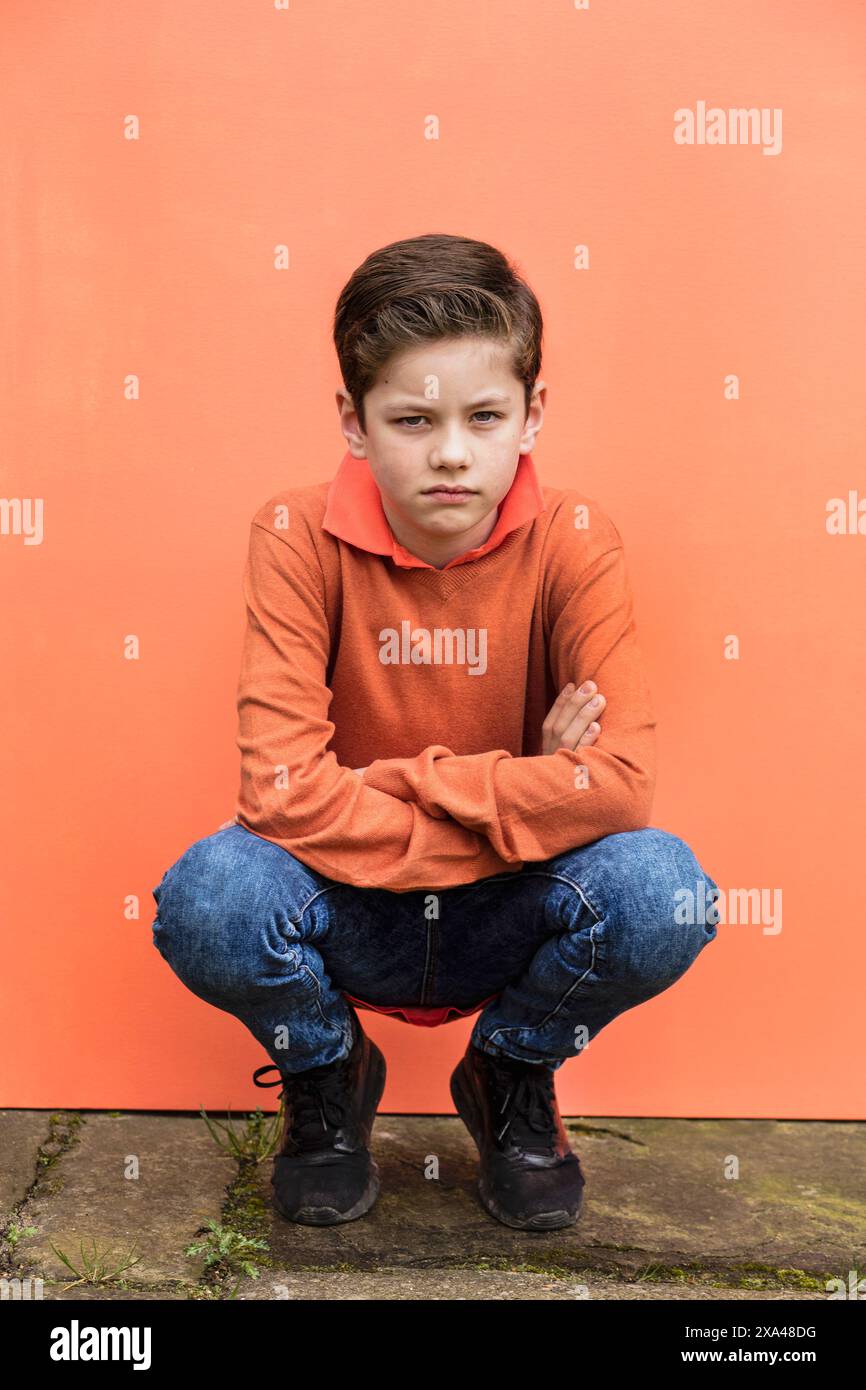 Boy crossed arms 8 hi-res stock photography and images - Alamy