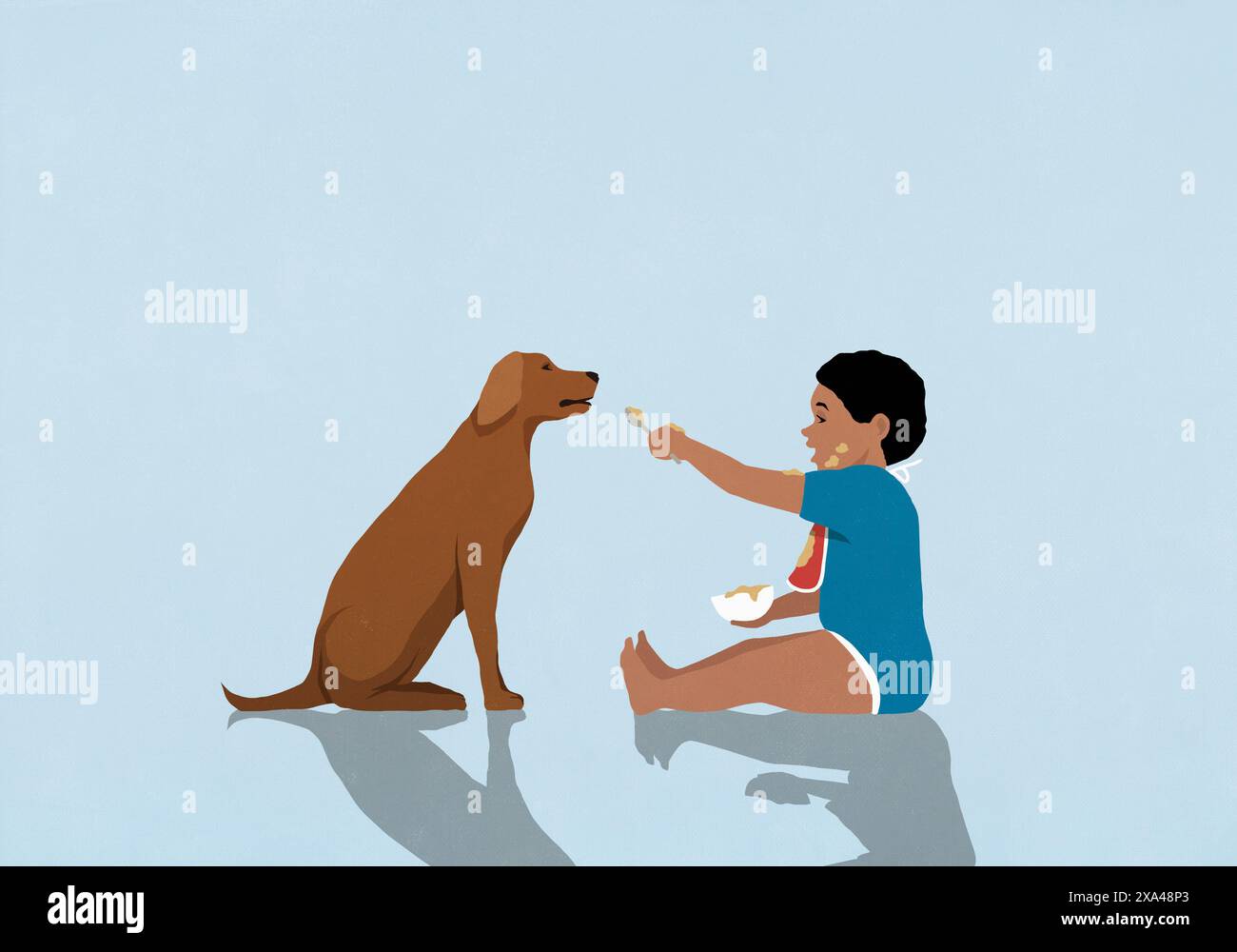 Baby boy feeding dog against blue background Stock Photo - Alamy