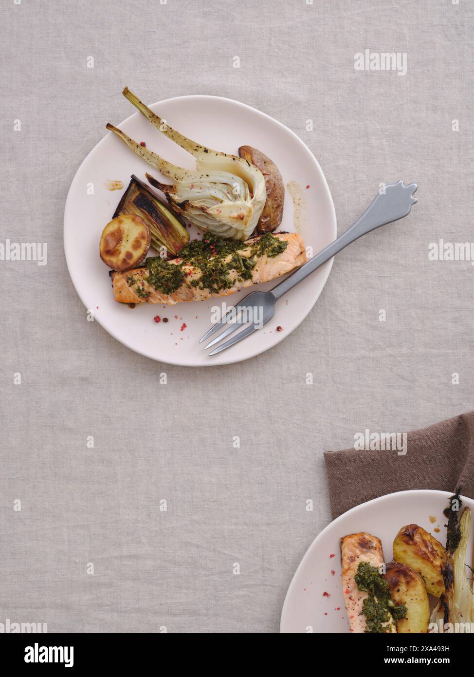 View from above gourmet meal of grilled salmon with pesto, baked ...