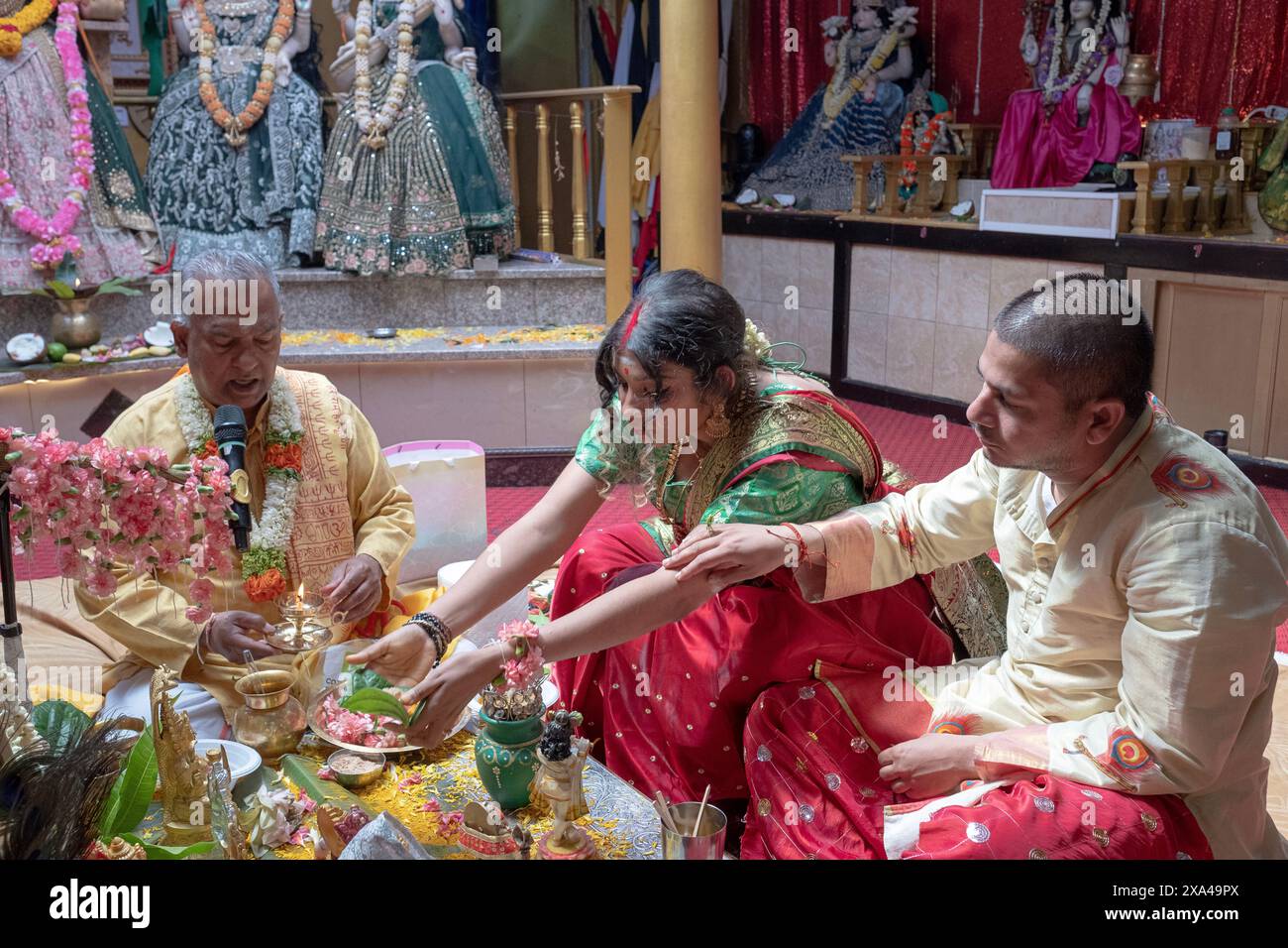 At Valaikappu service the parents to be & pandit perform rituals and ...