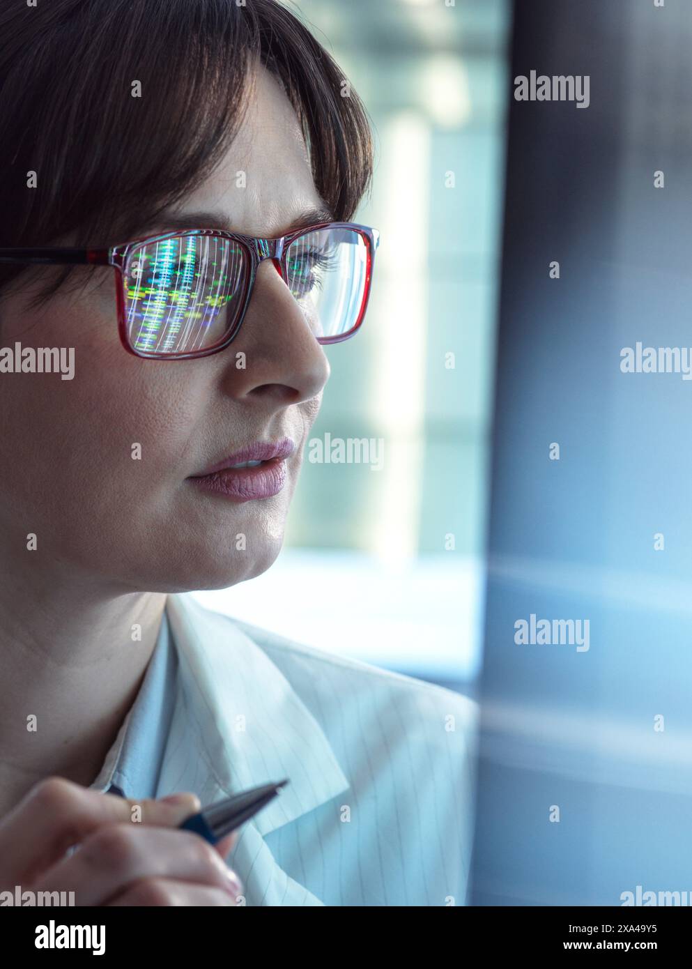 Genomics, Scientist viewing human DNA profiles on screen during testing ...
