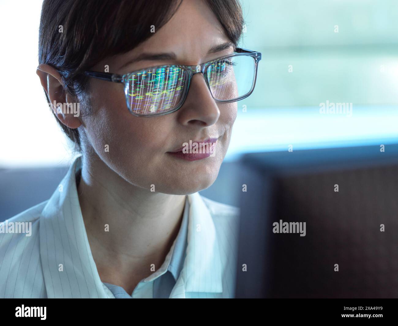 Genomics, Scientist viewing human DNA profiles on screen during testing ...