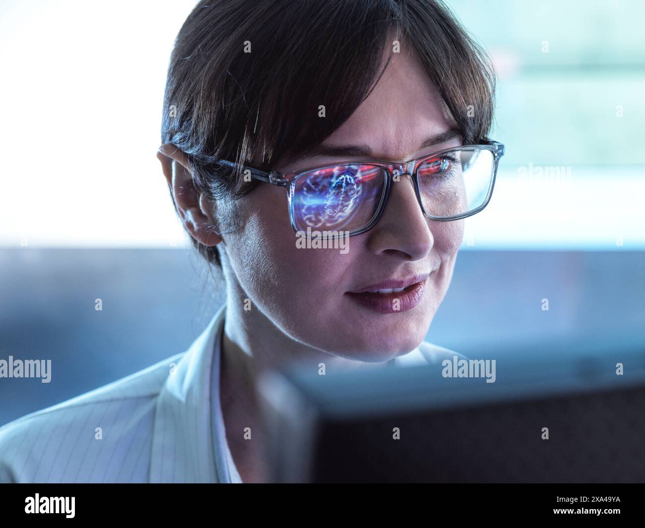 Neurology Research, Scientist viewing a brain scan during a clinical ...