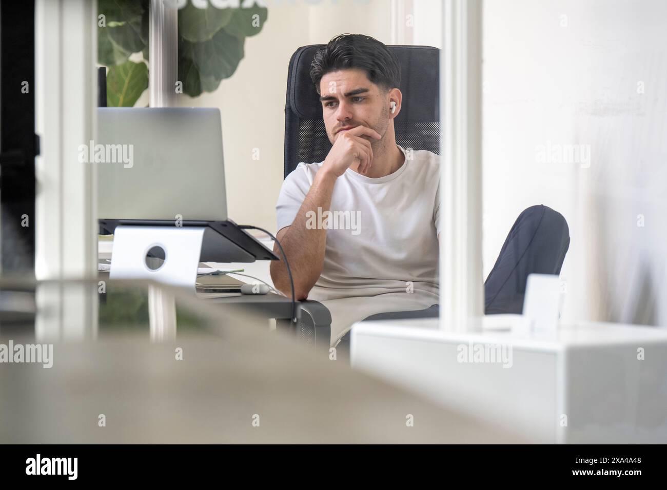 Man sitting thoughtfully desk office setting hi-res stock photography ...