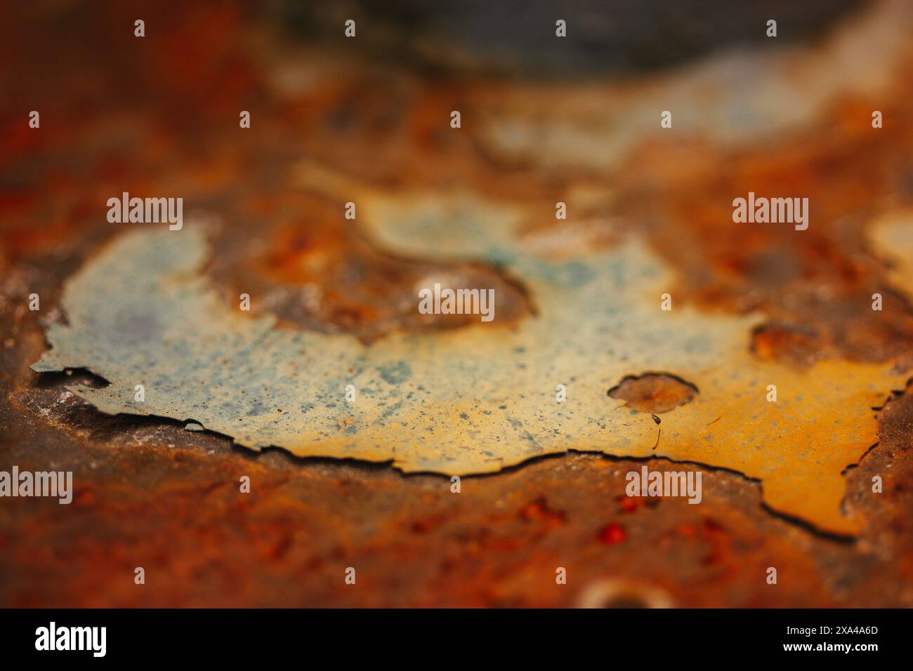 Abstract metal orange brown blue rust background. Grunge cracks ...