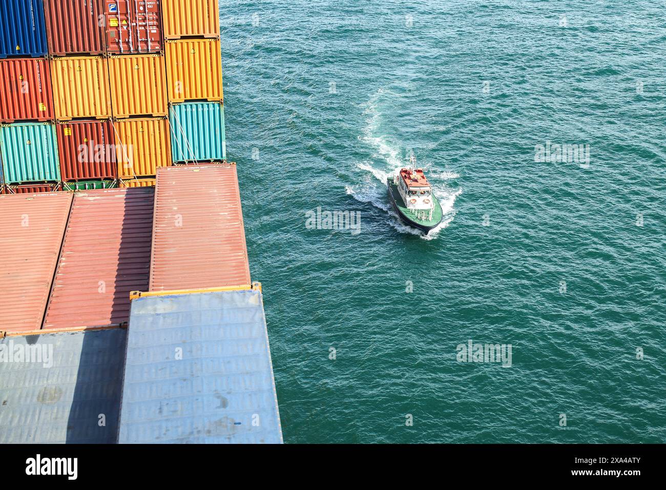 Aerial view of a section of a large cargo ship loaded with colorful ...