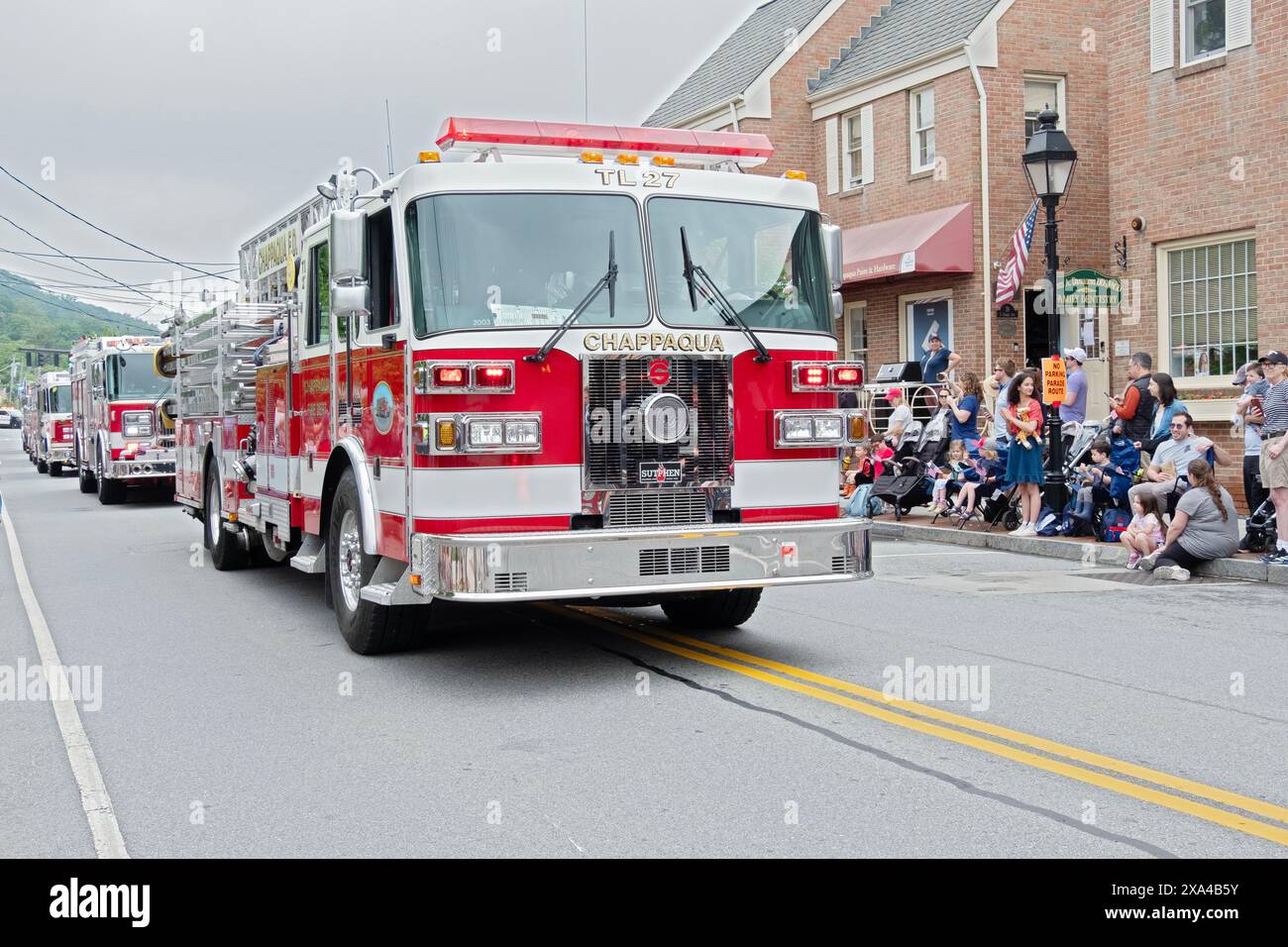 The Chappaqua volunteer fire department trucks ride near the start of ...