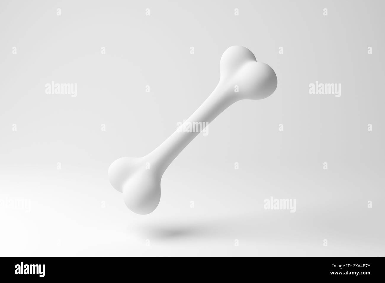 White bone floating in mid air on white background in monochrome and ...