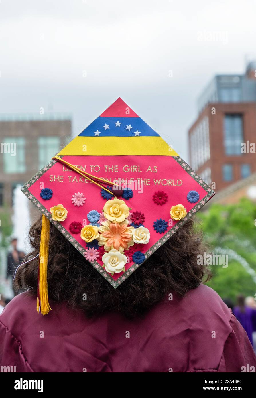 View from behind of a decorated graduation cap with bits of the ...