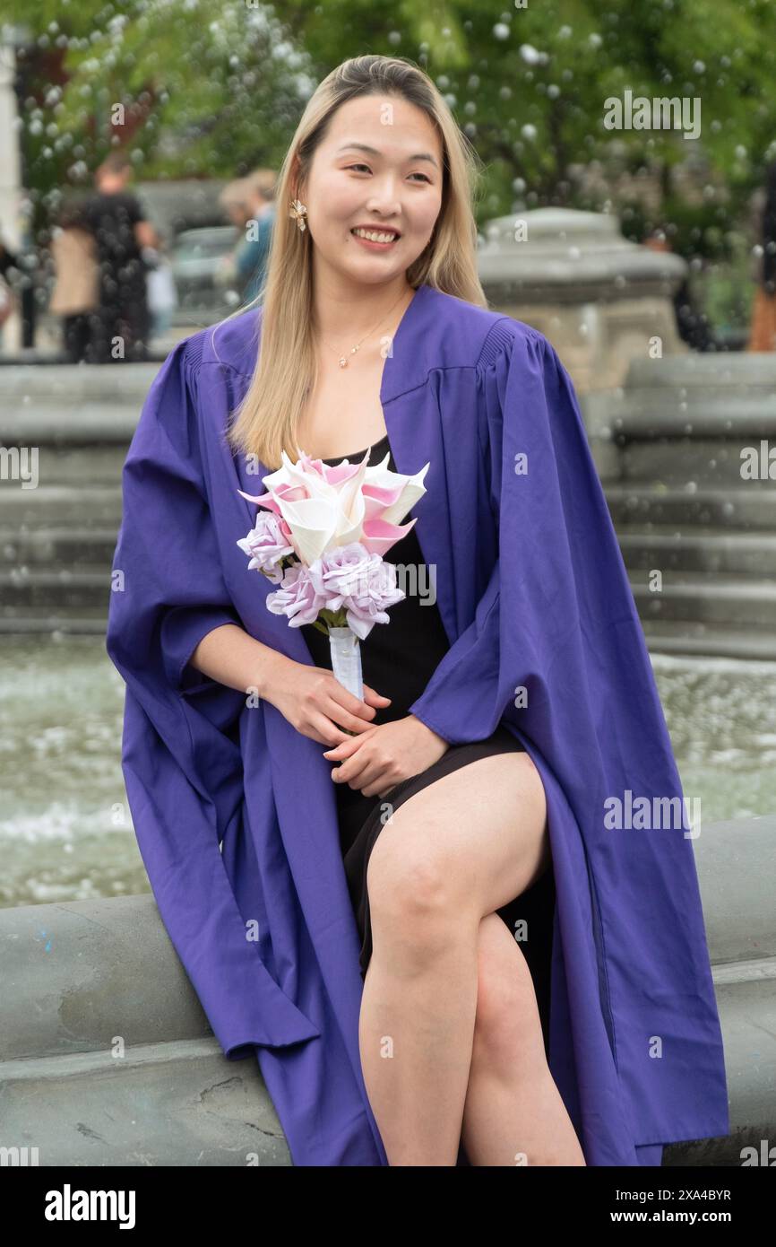 After the NYU 2024 graduation ceremony a beautiful Asian American woman ...