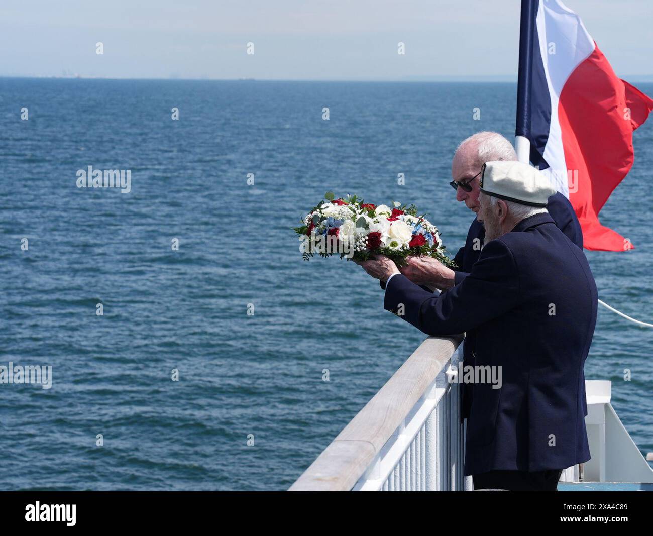 D-Day veterans Harry Birdsall, 98, and Alec Penstone (front), 98, throw ...