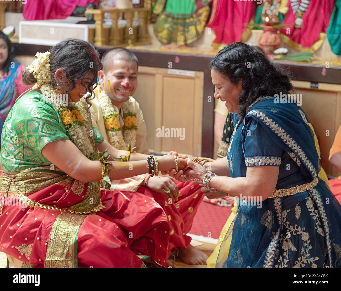 At a Valaikappu service its customary to put bracelets on the wrist of ...