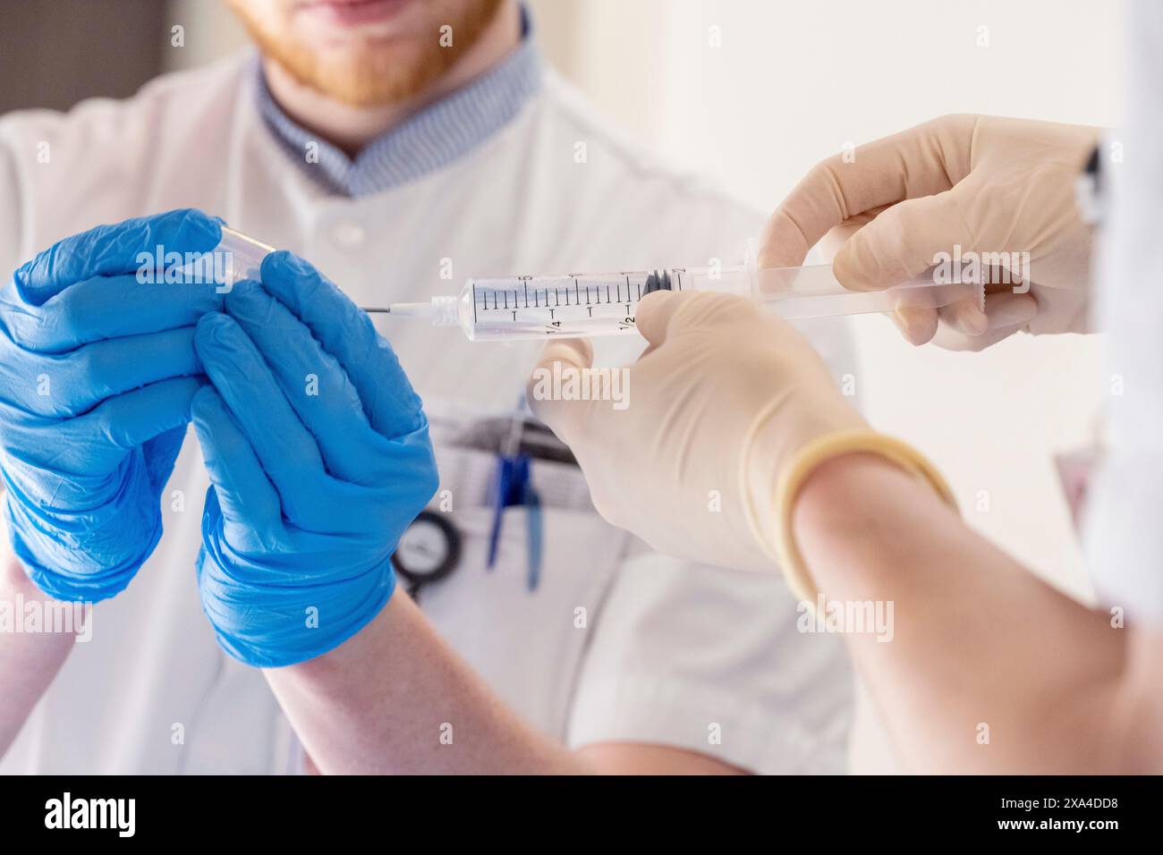 Healthcare professional administering injection patient hi-res stock ...