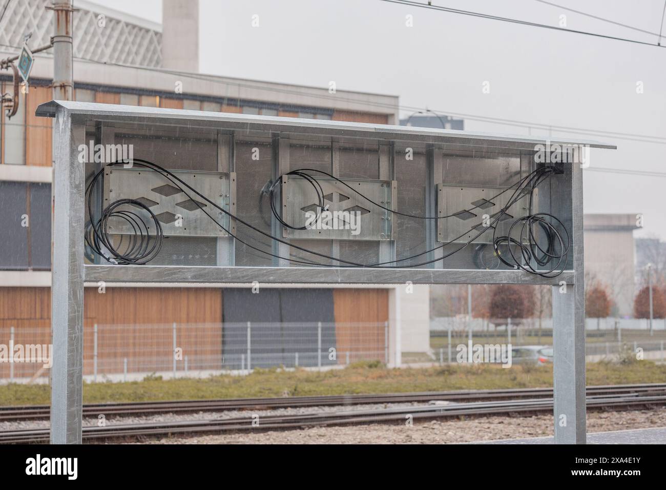 Empty metal frame for LED displays on a train platform. Station ...