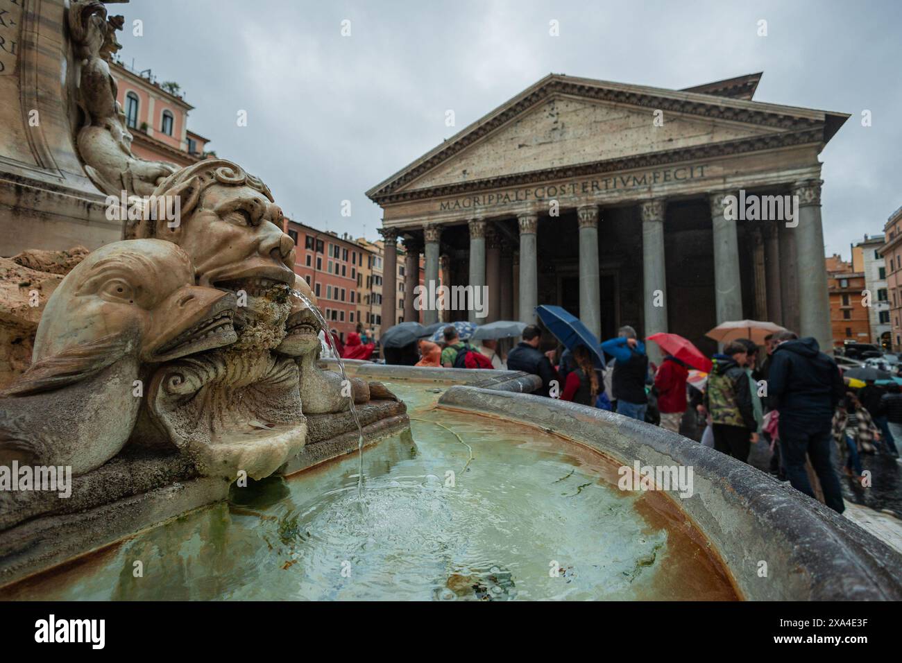 Detail of a fountain at a square on crowded panteon building in Rome ...