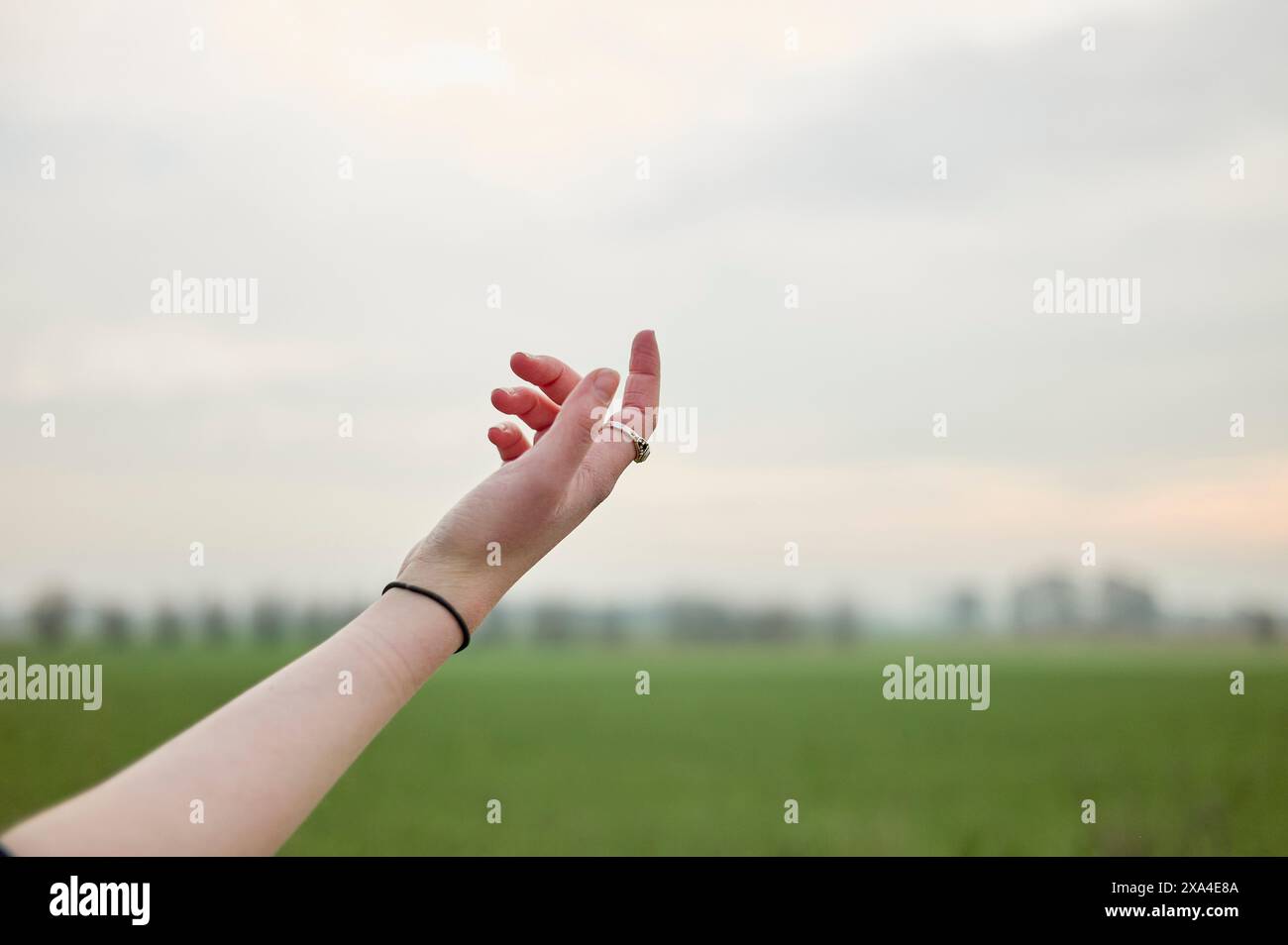 Hand reaching to sky hi-res stock photography and images - Alamy