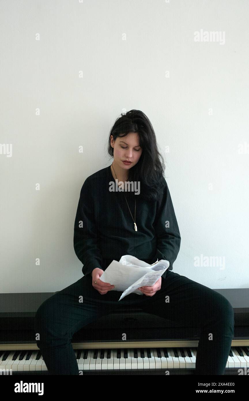 Reading sheet paper focused expression hi-res stock photography and ...