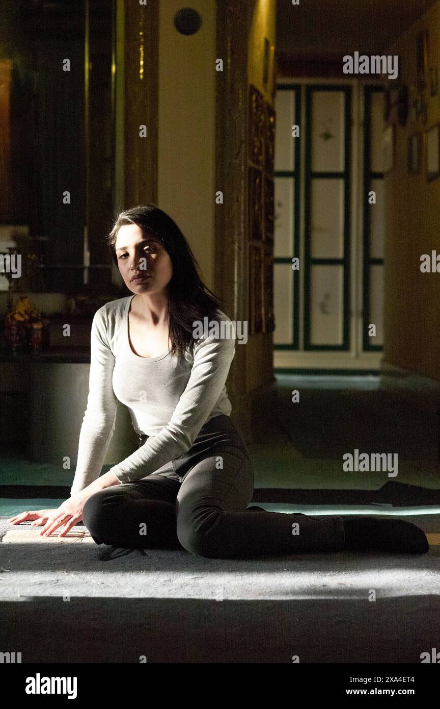 Woman performing yog pose mat indoors hi-res stock photography and ...