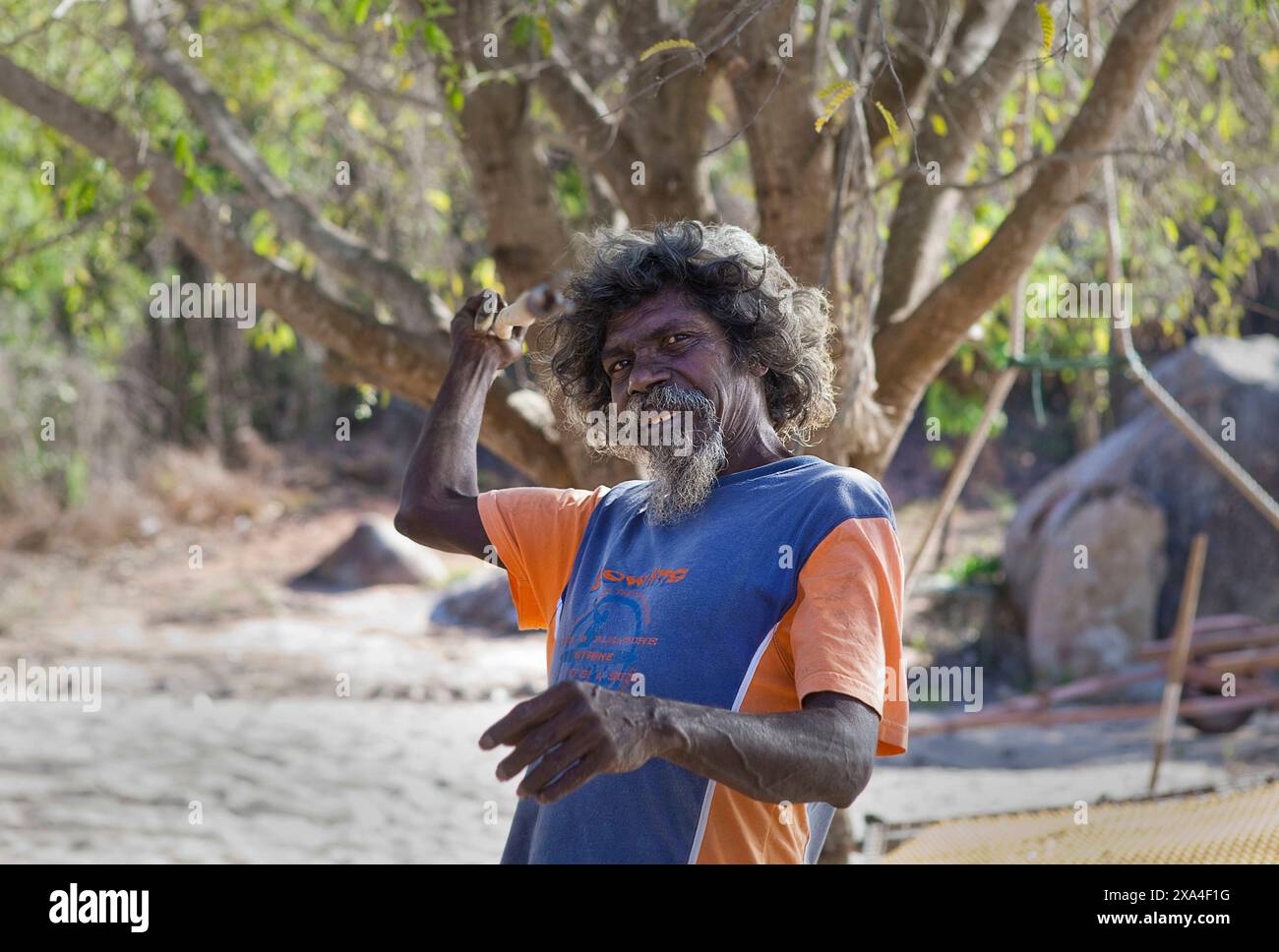 Portrait, Yolngu man, showing spear fishing action at Bawaka Homeland ...