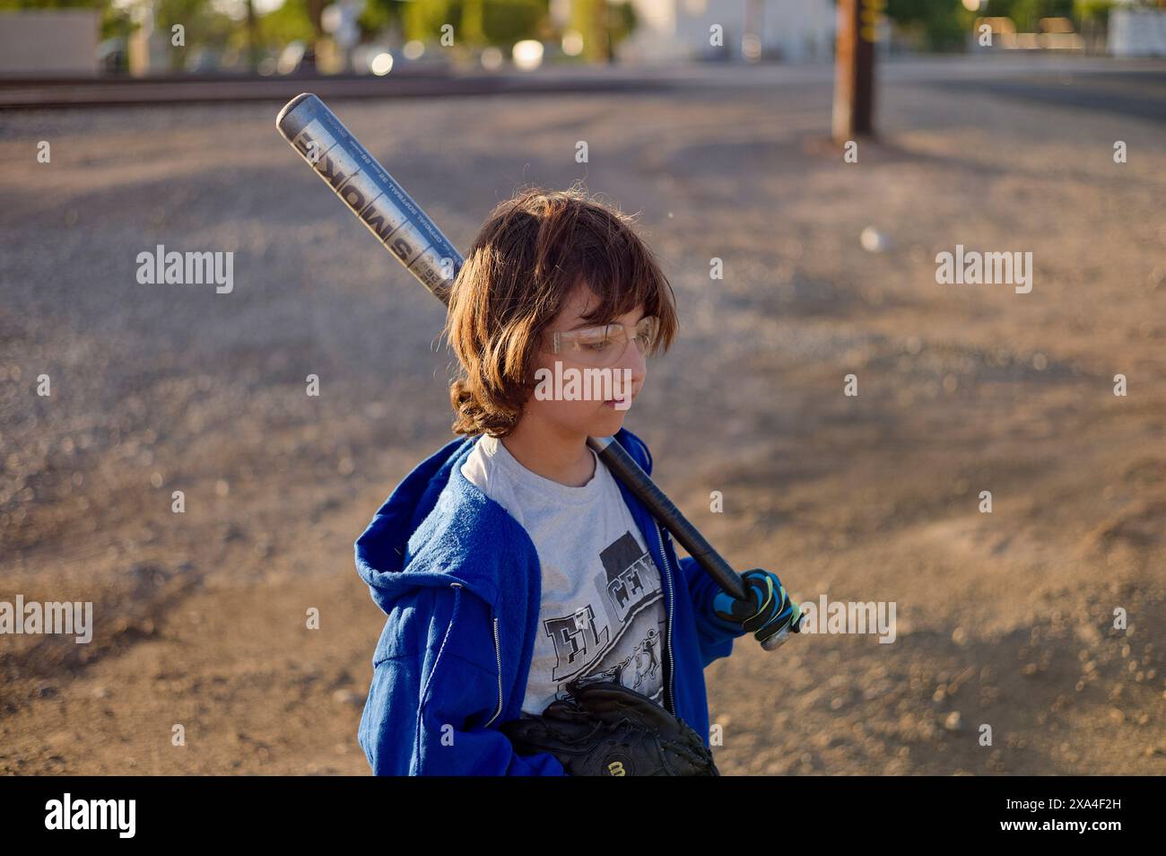 Blue jacket holding baseball bat shoulder hi-res stock photography and ...