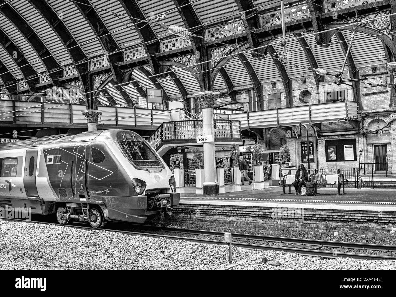 A train rests by a historic 19th Century railway station platform. A ...