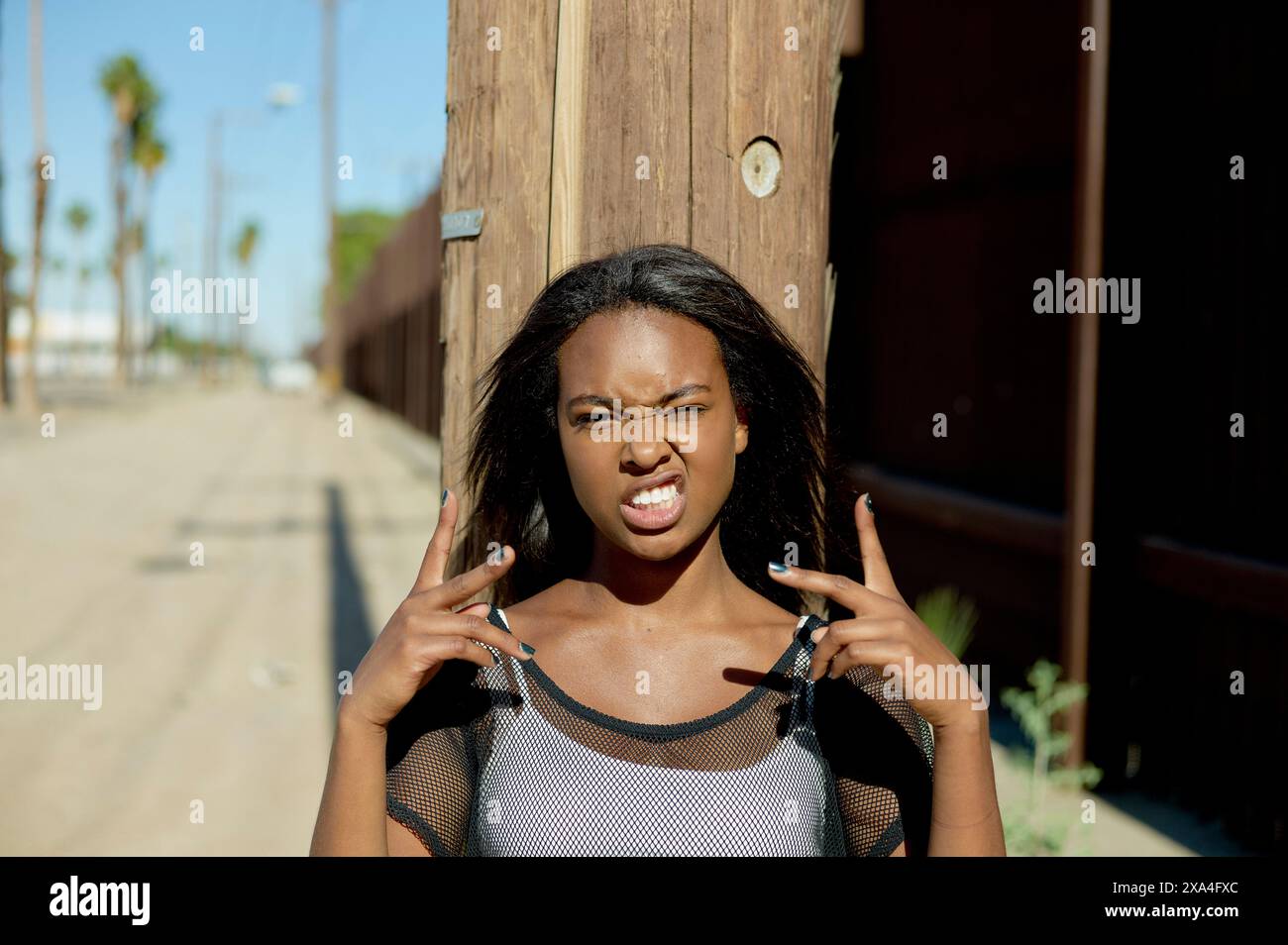 Expressive young woman stands hi-res stock photography and images - Alamy