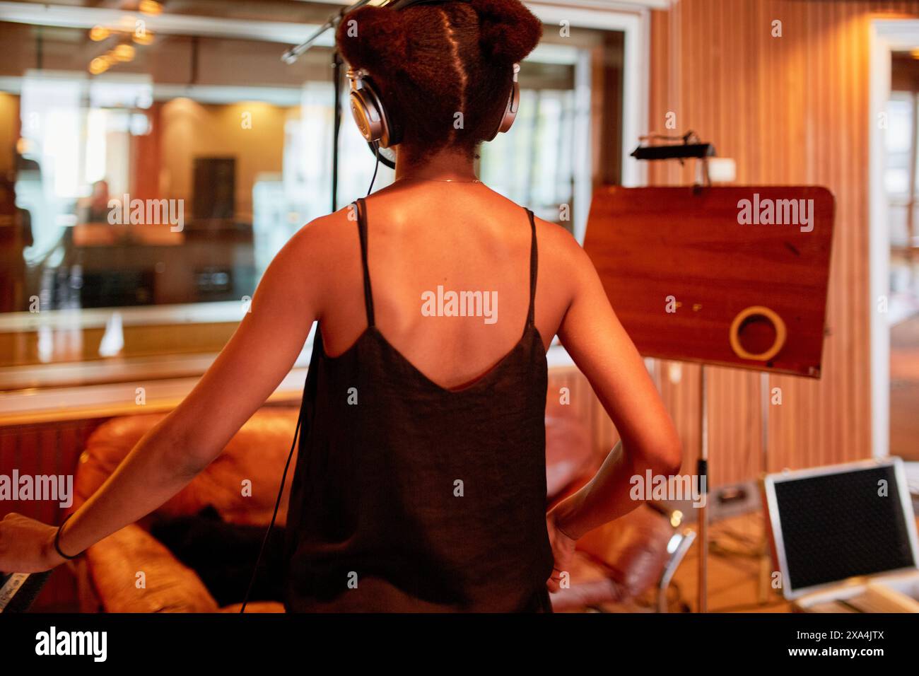 Female singer seen behind recording studio hi-res stock photography and ...