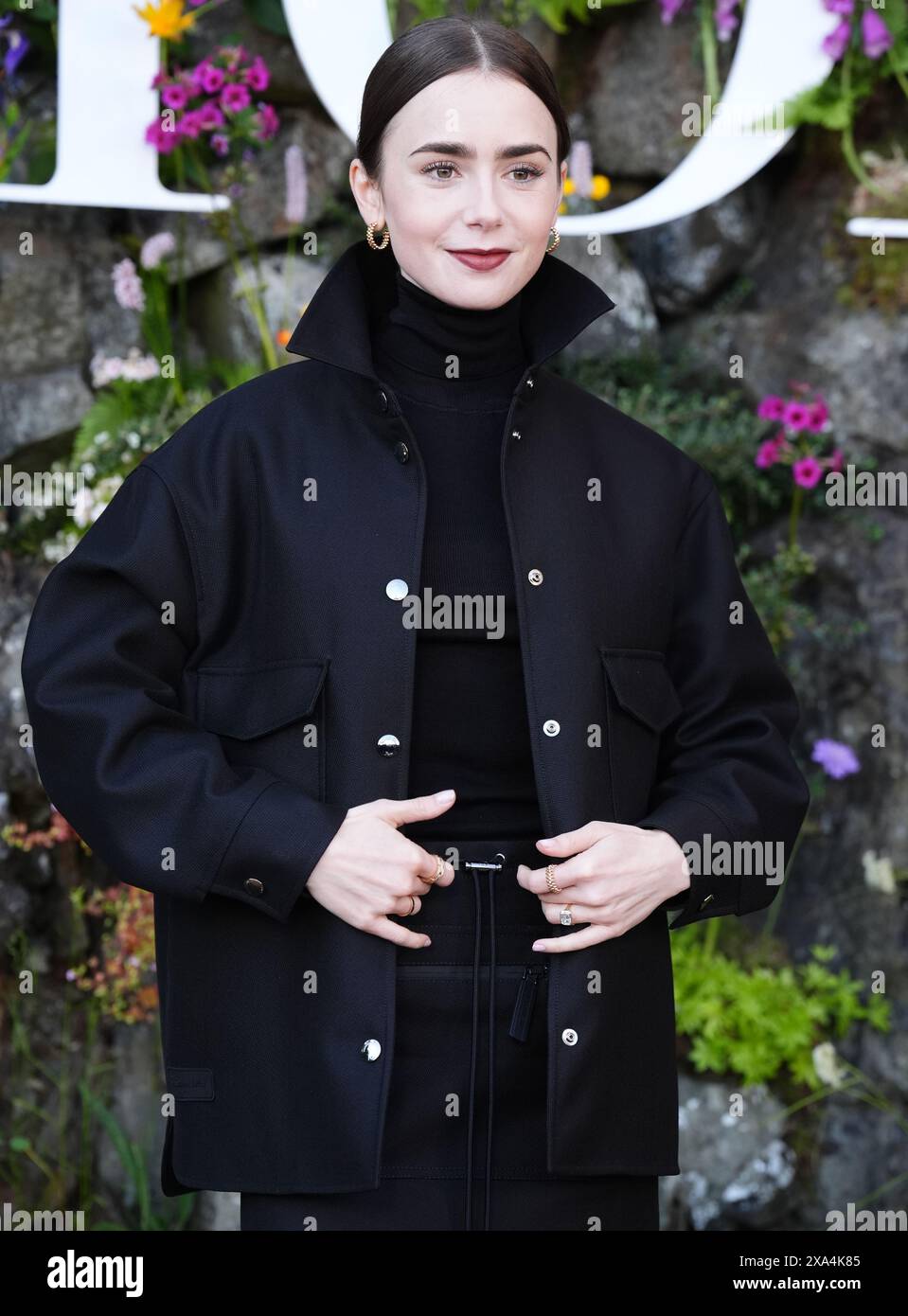 Lily Collins attends the Dior Cruise 2025 show at Drummond Castle ...
