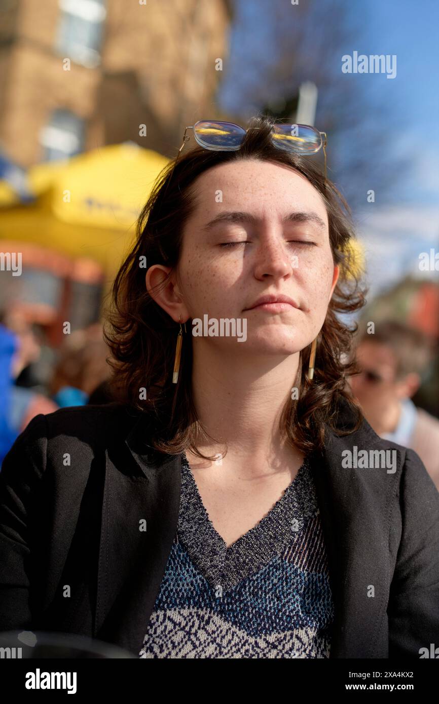Young woman closed eyes enjoys sunlight face hi-res stock photography ...