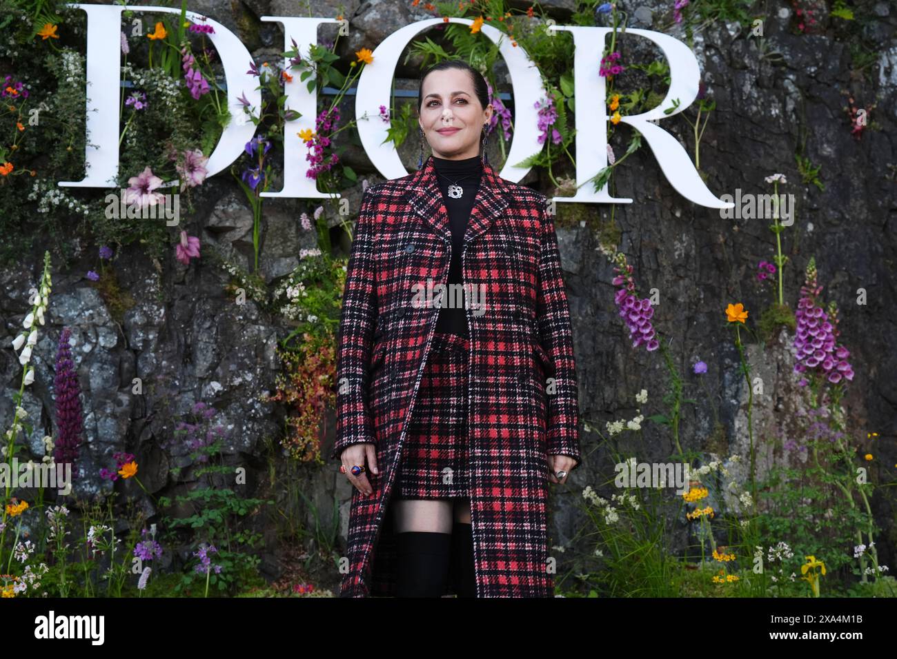 Amira Casar attends the Dior Cruise 2025 show at Drummond Castle ...