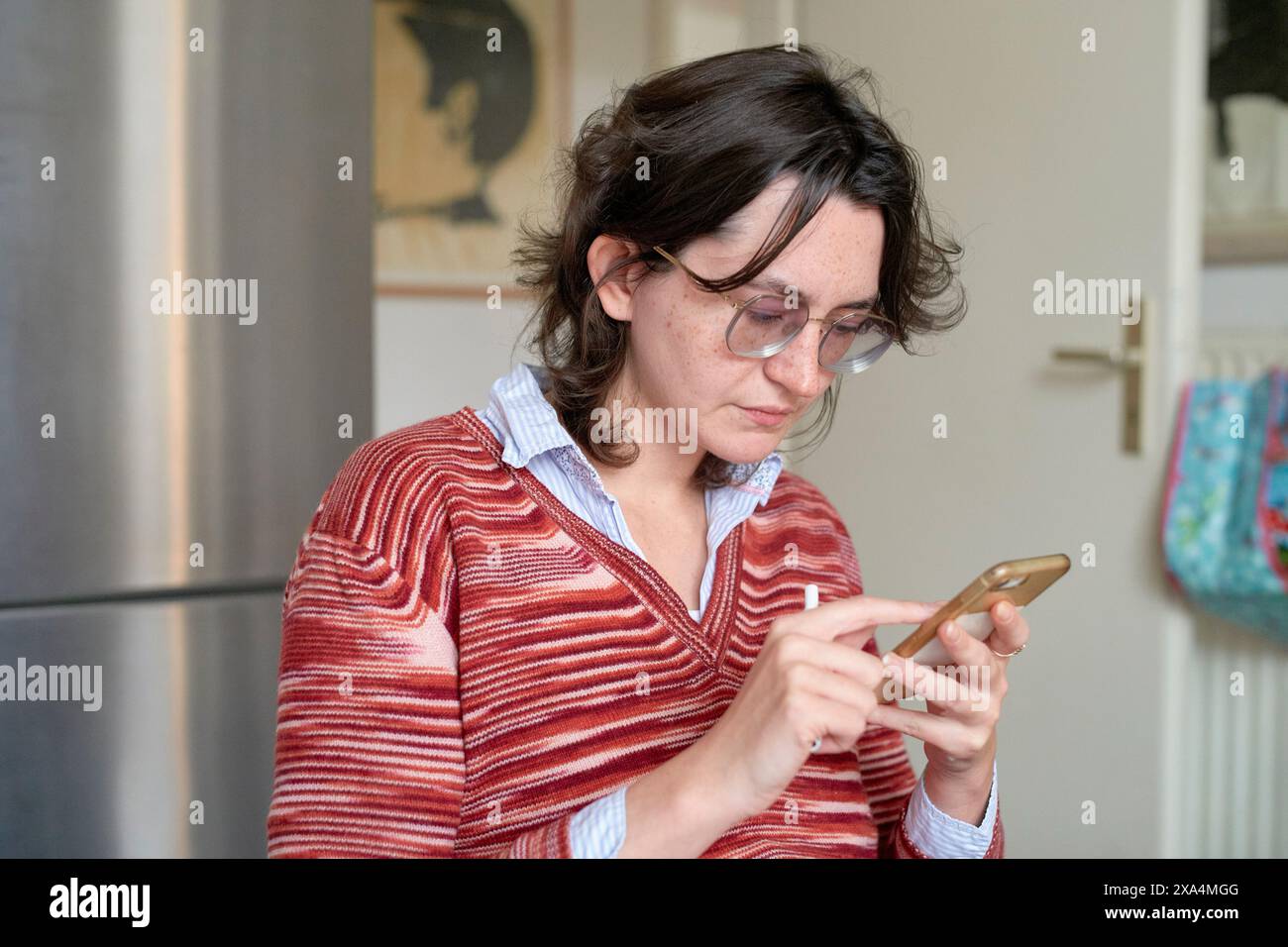 Focused woman in striped shirt hi-res stock photography and images - Alamy