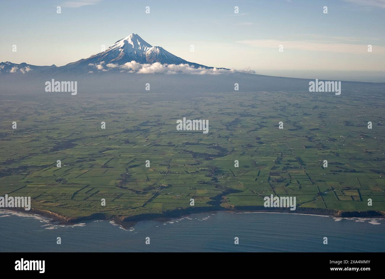 Aerial view of a majestic snow-capped mountain towering over a ...